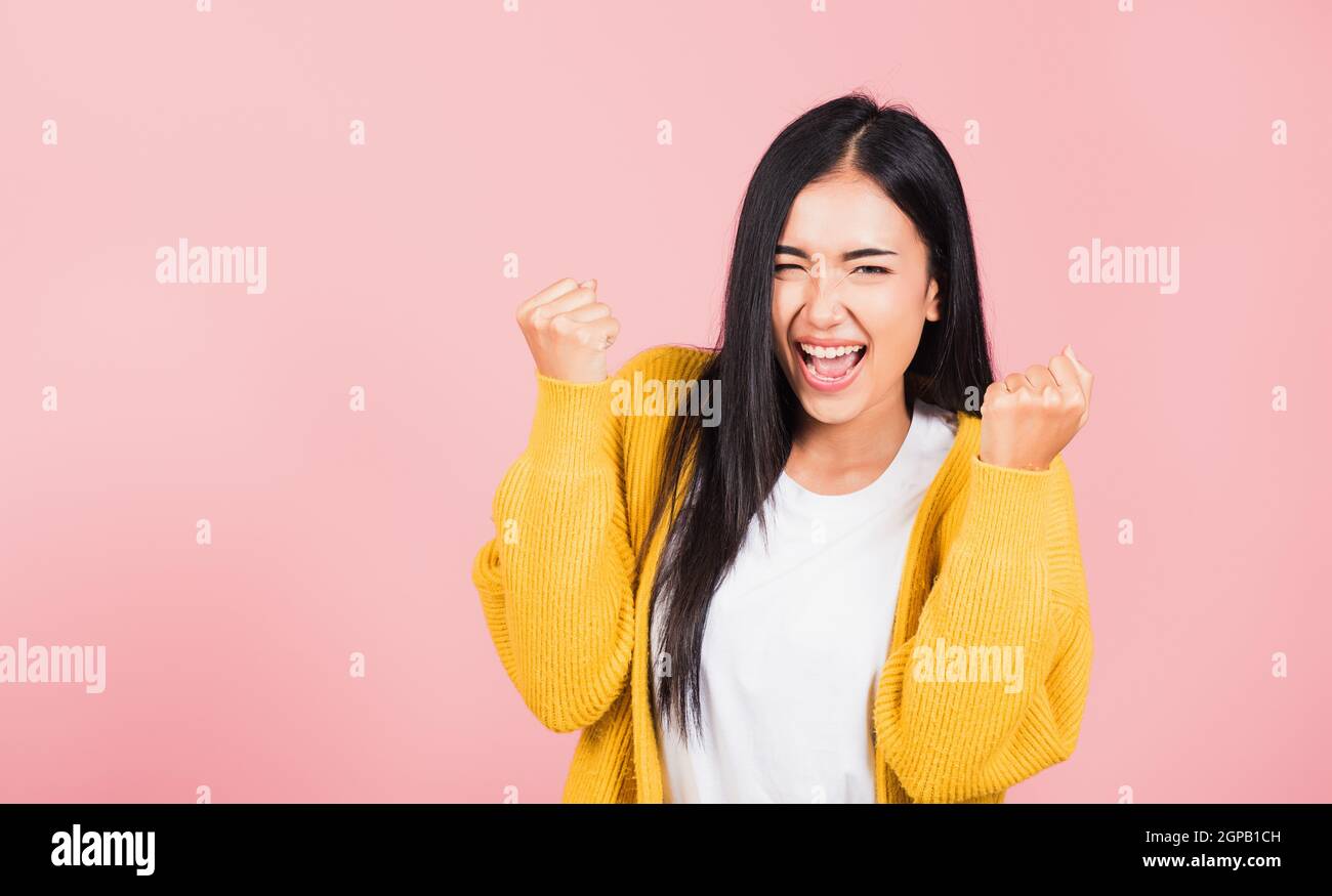 Happy Asian portrait beautiful cute young woman standing winning and ...