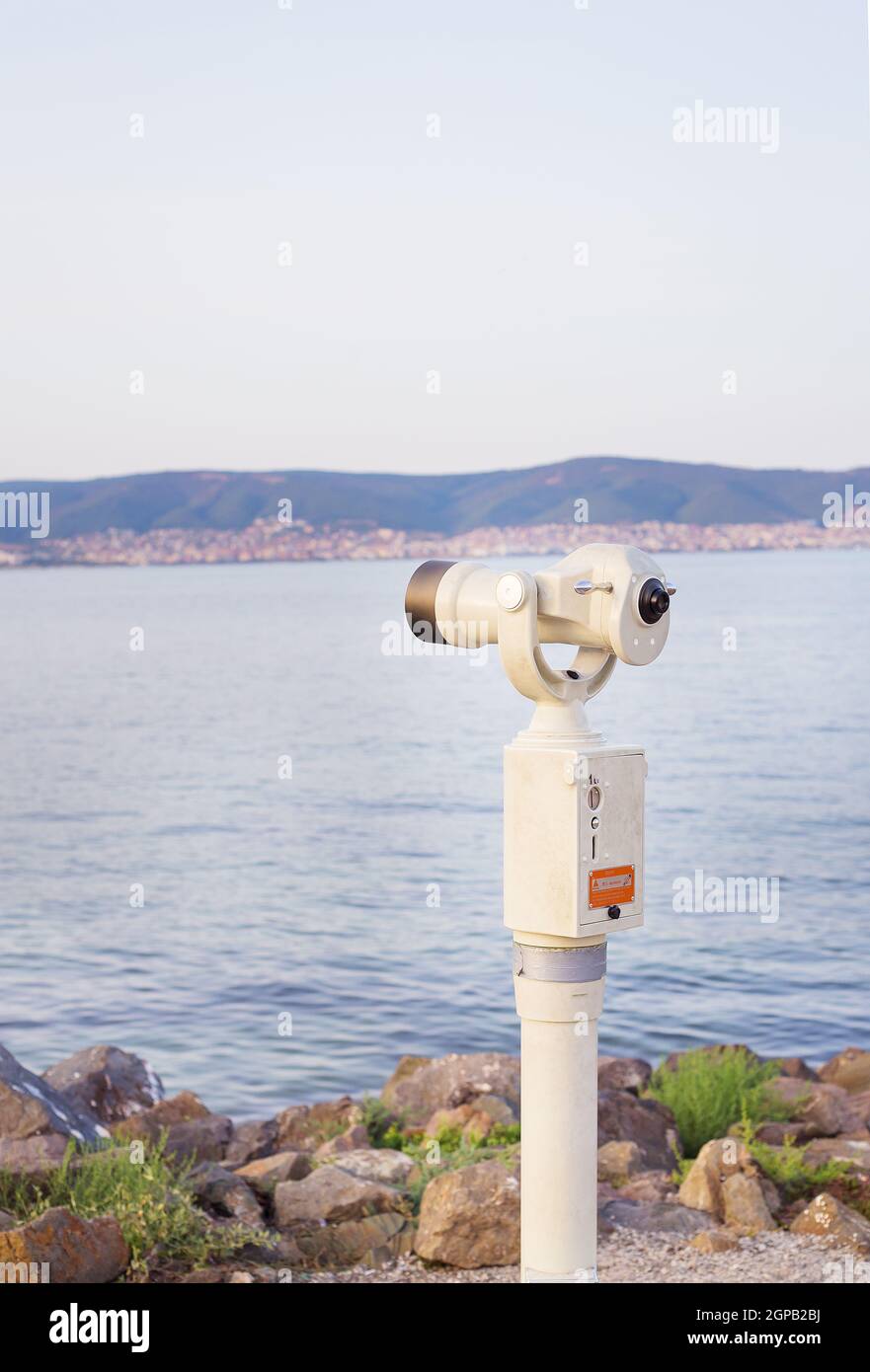 Telescope on the sea-summer, sun, sea beach Stock Photo - Alamy