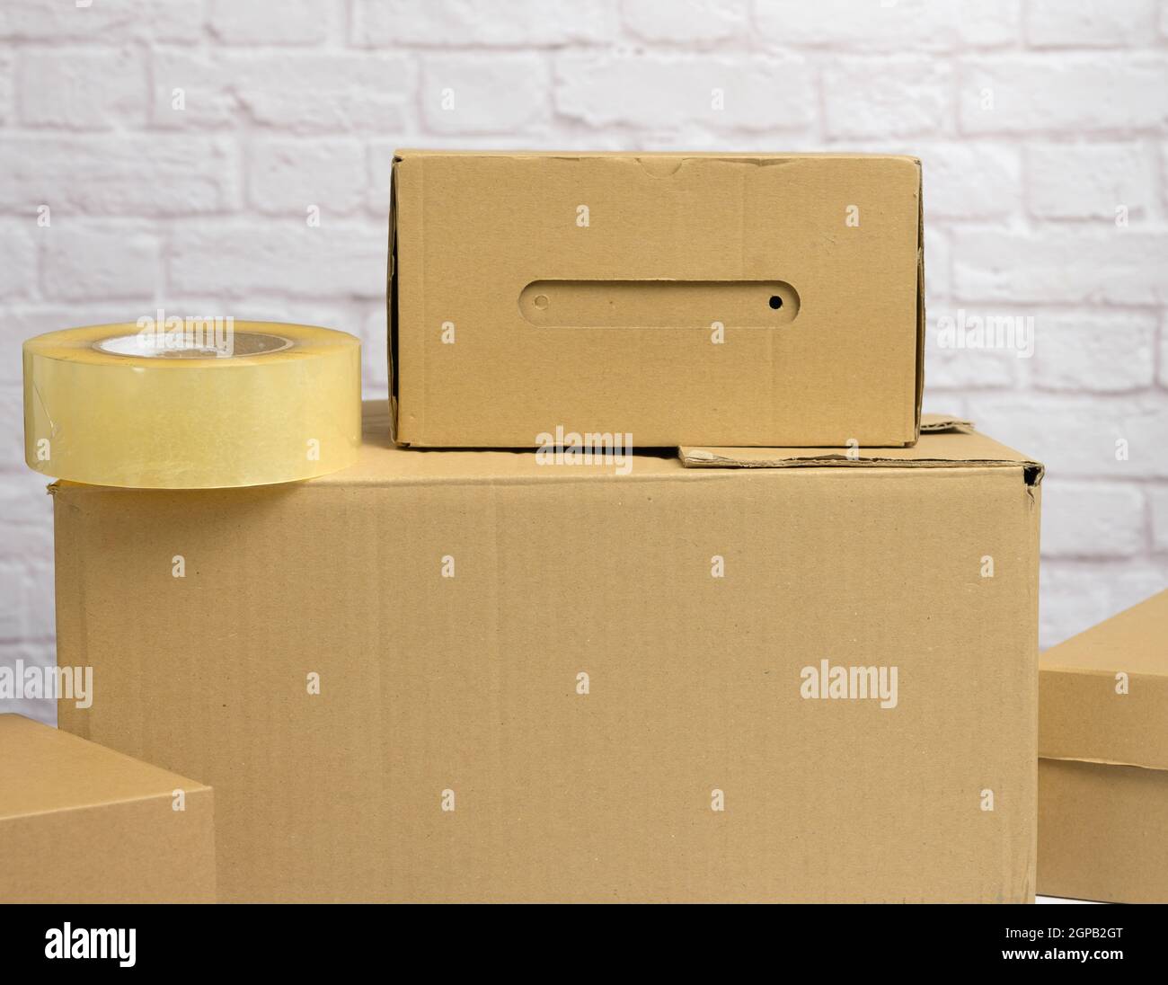 lot of brown cardboard boxes, the process of packing things when moving ...