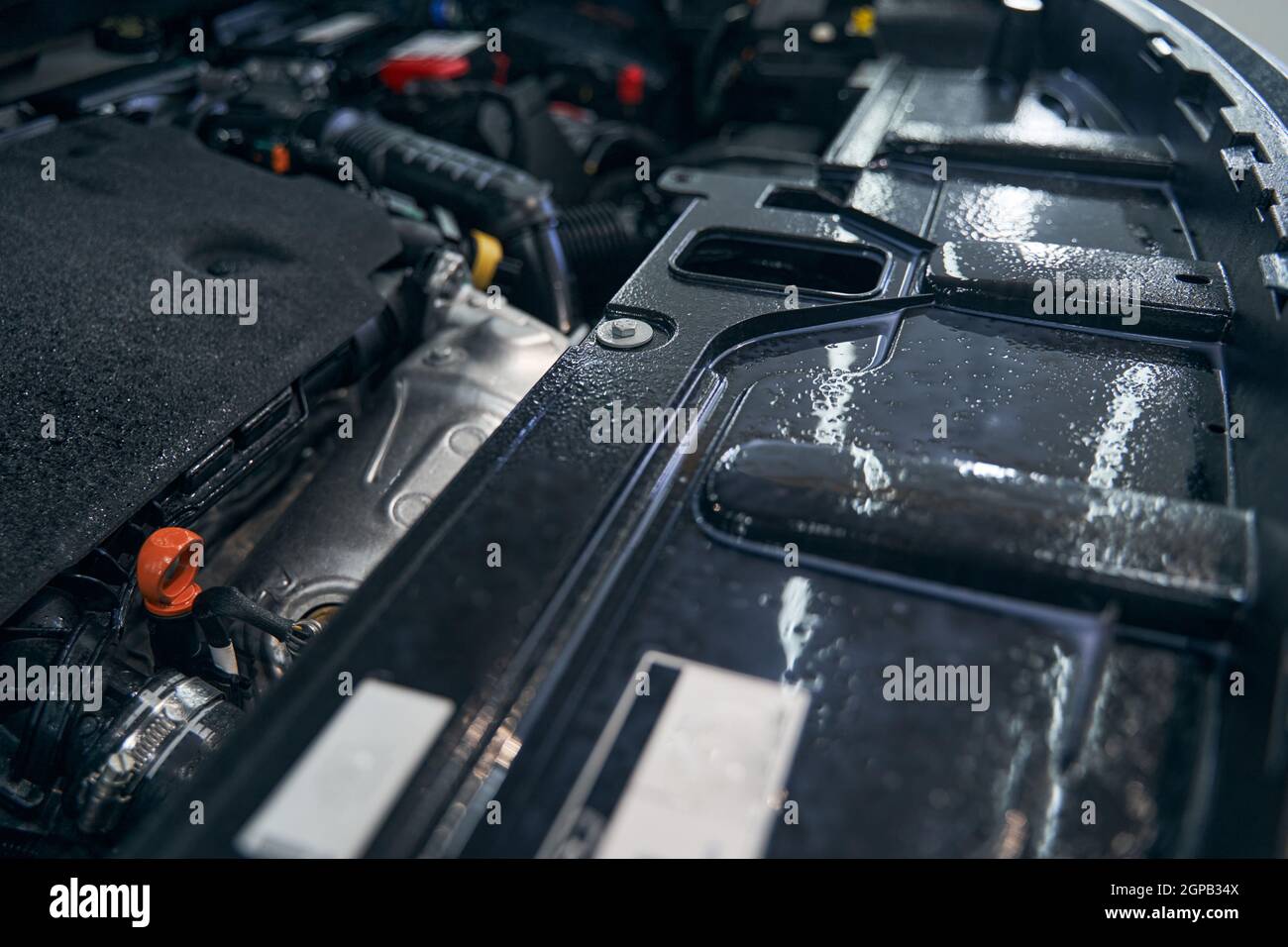 Clear engine and opened hood of modern car in service. Dry cleaning ...