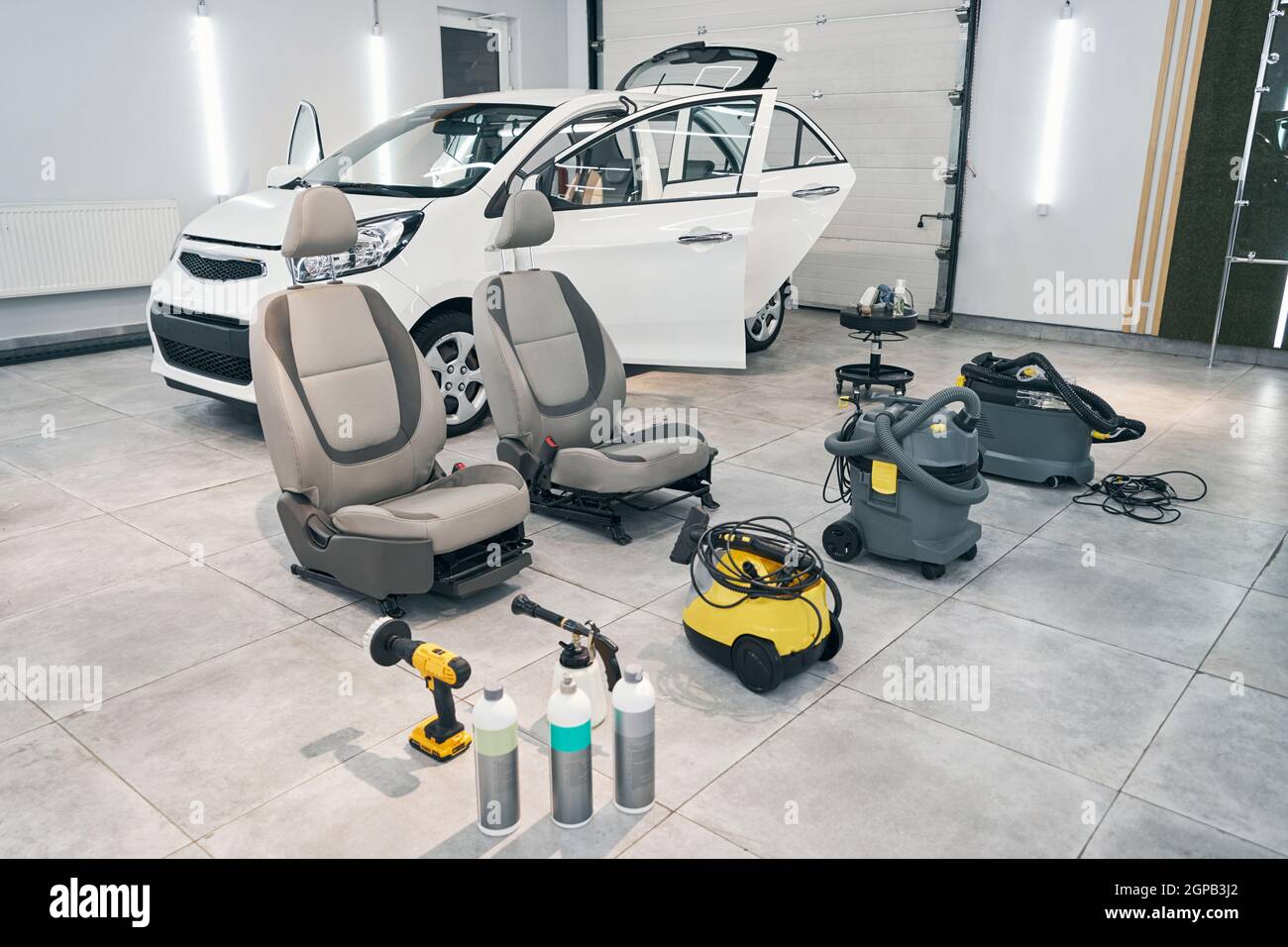 Modern white sedan car after detailing at car service showroom Stock ...