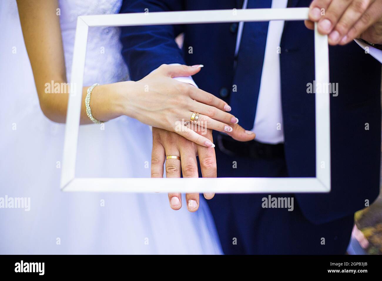 Marry me today and everyday. Newlywed couple holding hands, wedding ...