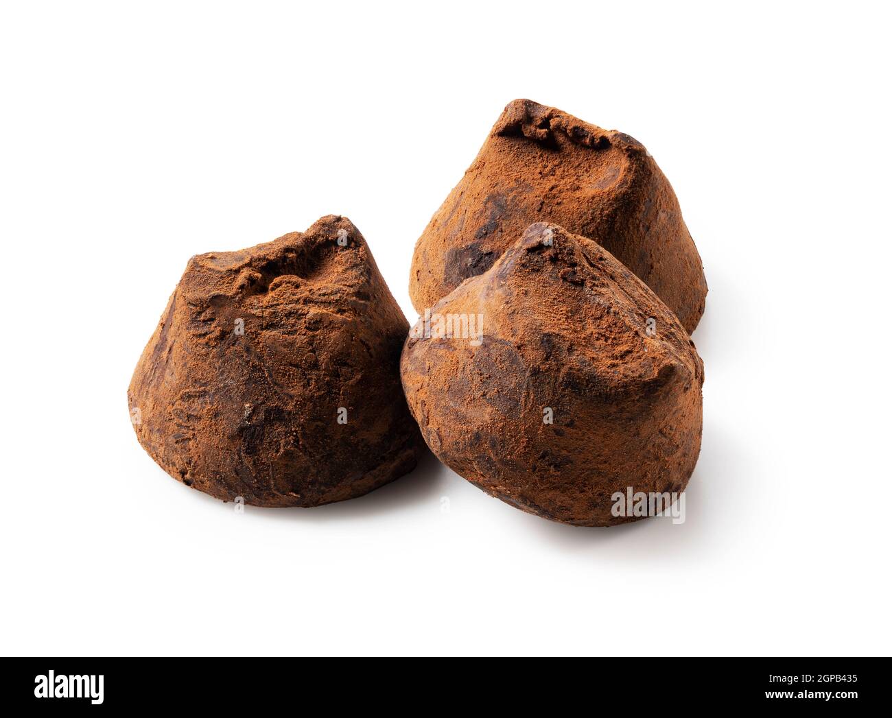 Chocolate truffles with cocoa powder on a white background Stock Photo ...