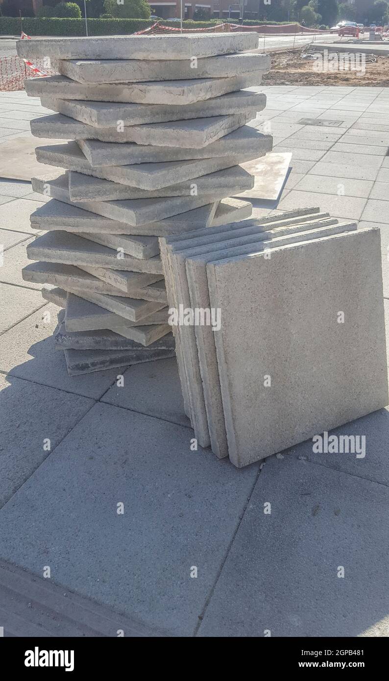 Stacks of paving slabs in piles ready to place on pavement. Closeup ...