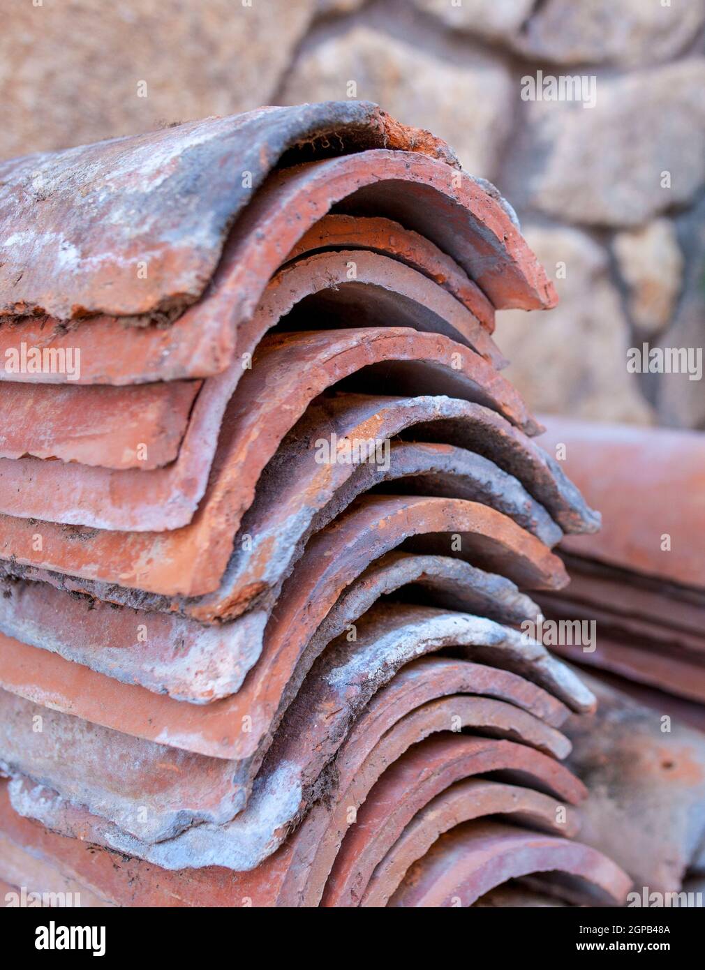 Packs of reused mediterranean roof tiles or monk and nun. Building ...