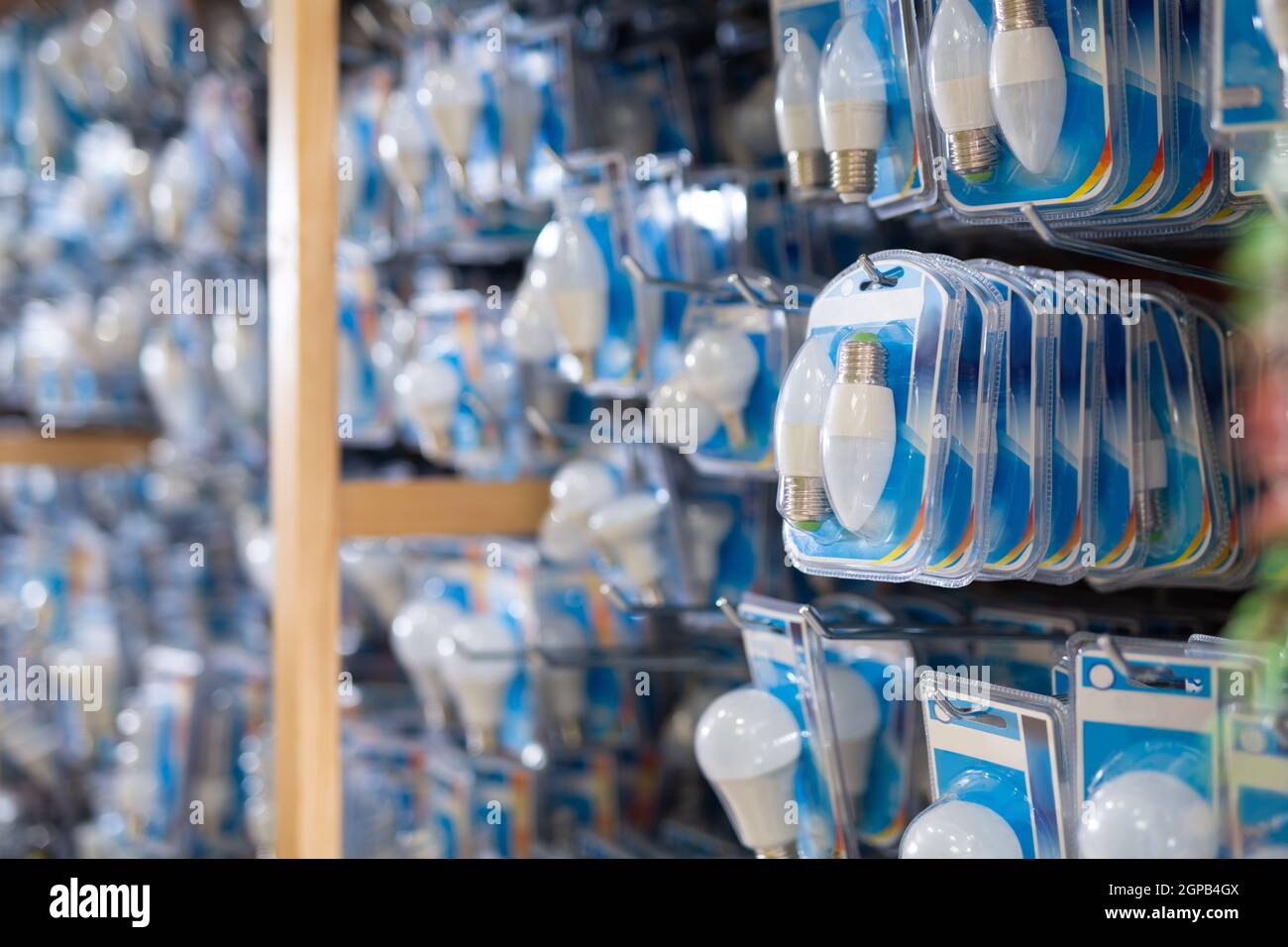 Energy saving lamps on shelves of an electrical goods store Stock Photo ...