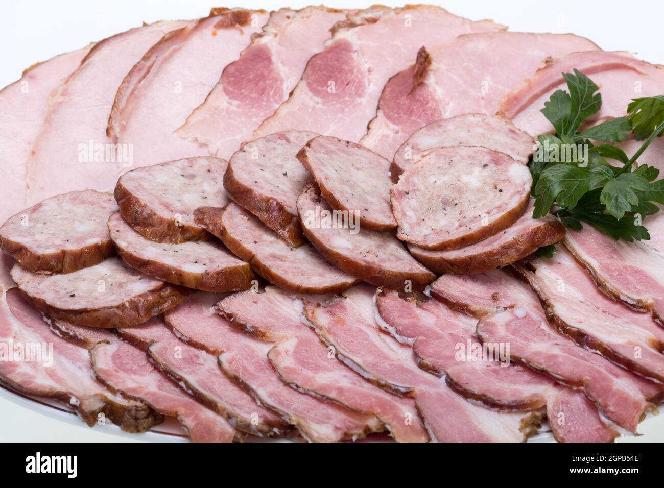 Plate of smoked meat isolated on white background Stock Photo - Alamy