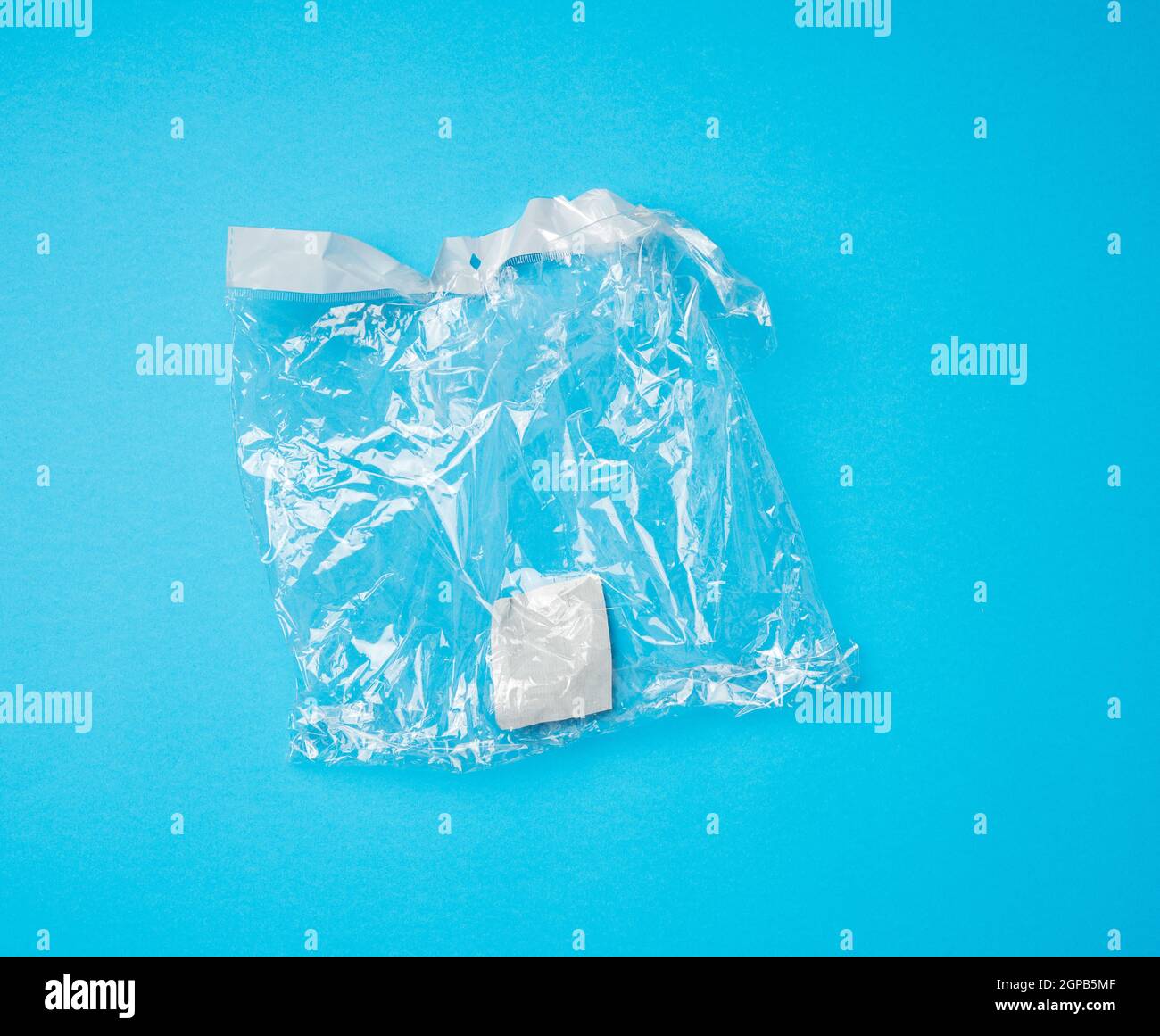blank transparent plastic bag on blue background, top view Stock Photo ...