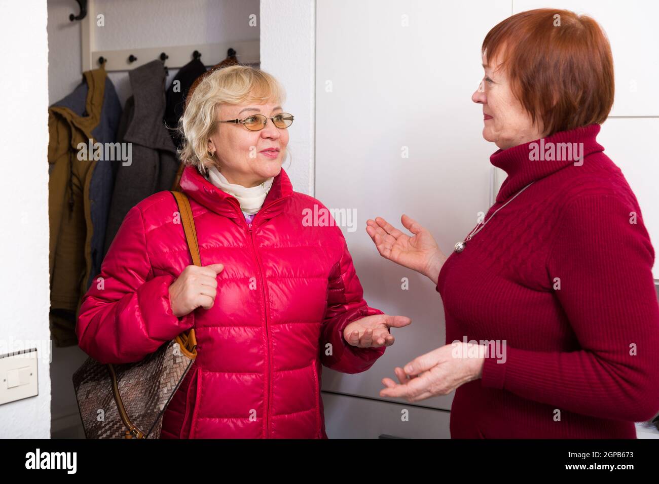 Elderly woman visiting female friend Stock Photo - Alamy