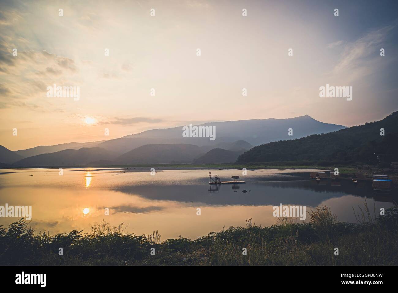 Mountain, sky and river in a quiet and cool atmosphere. Similar color ...