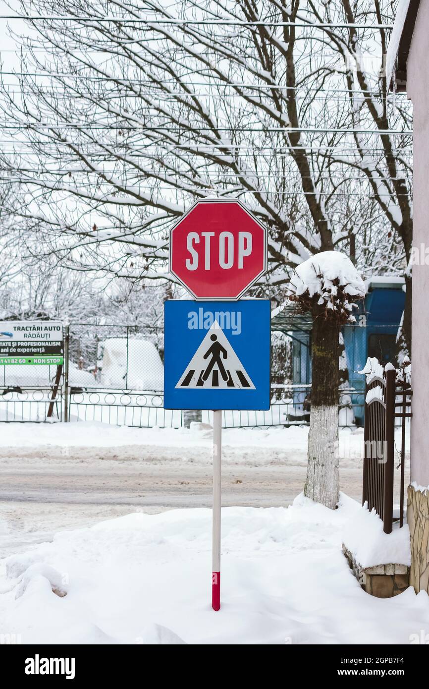 Road signs during winter. Red stop sign. Crosswalk sign Stock Photo - Alamy