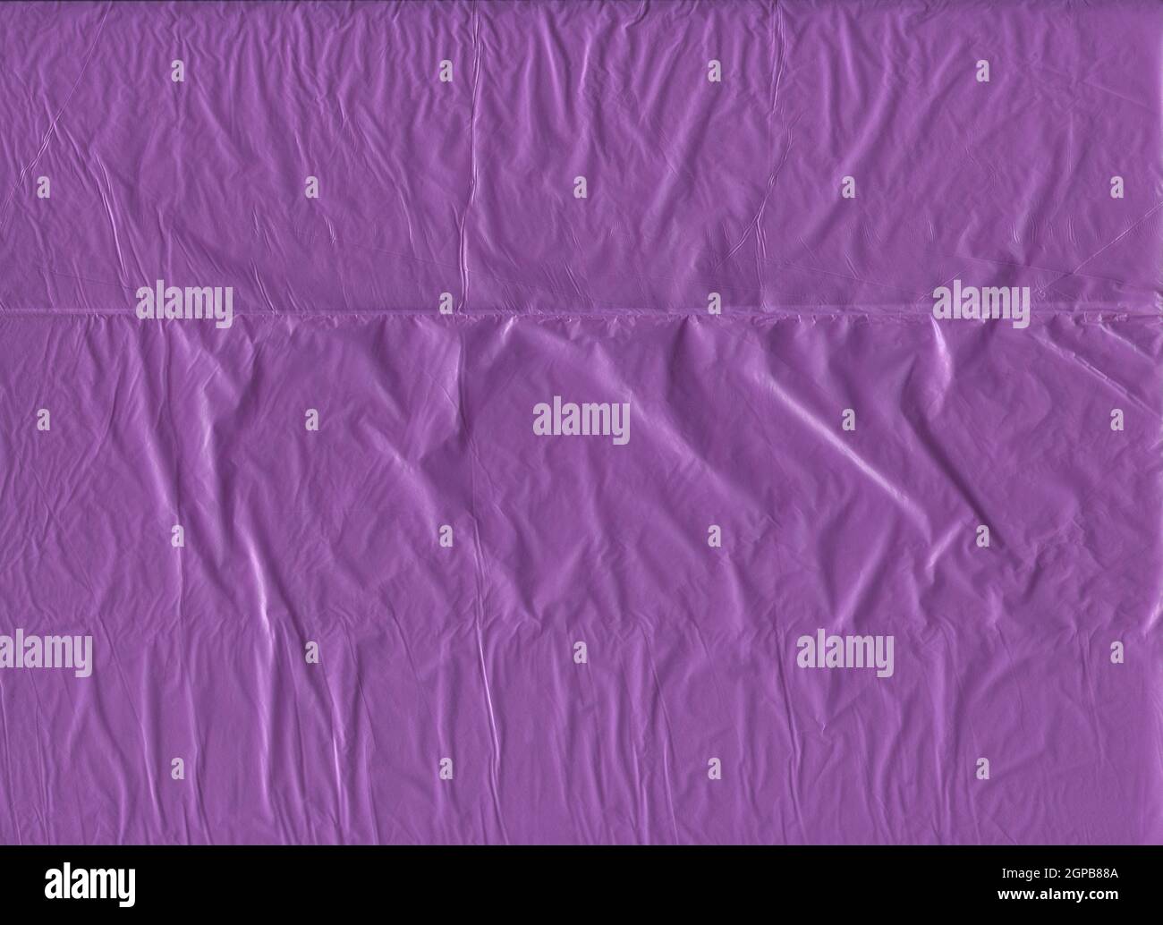 front view closeup of wrinkled violet plastic bag pattern texture ...