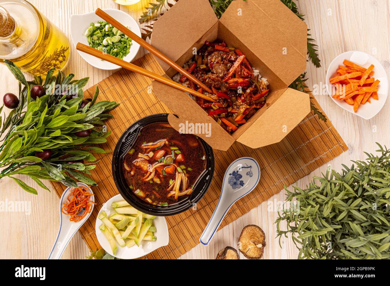 Flat lay of Chinese food in boxes, soup and main course Stock Photo - Alamy
