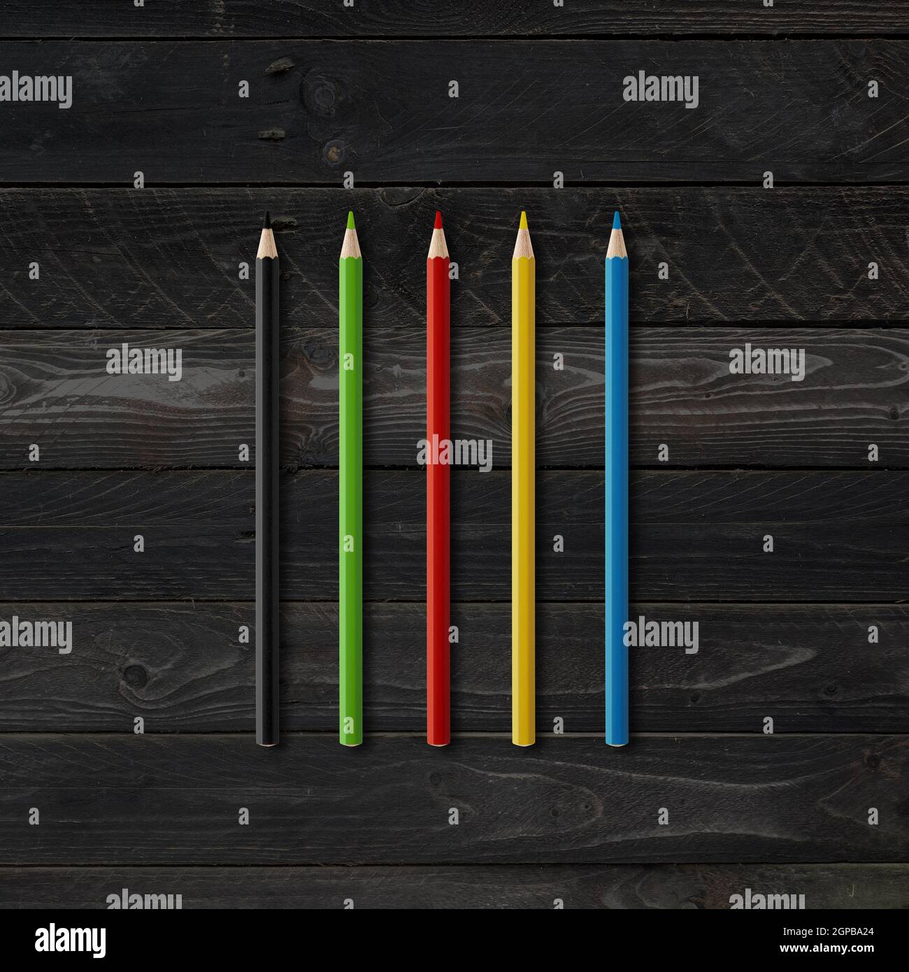 Colouring pencils mockup isolated on black wood background Stock Photo ...
