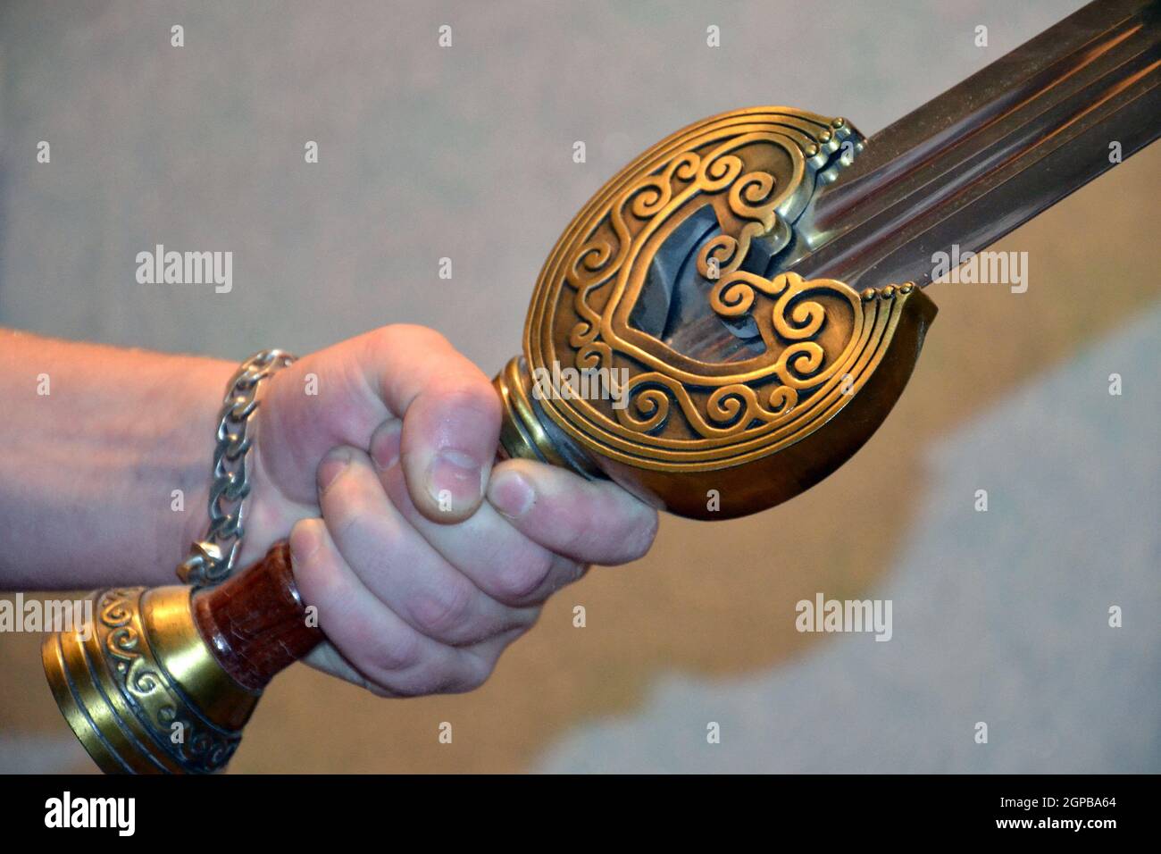 Sword at a hand. Fitting of the knightly weapon Stock Photo - Alamy