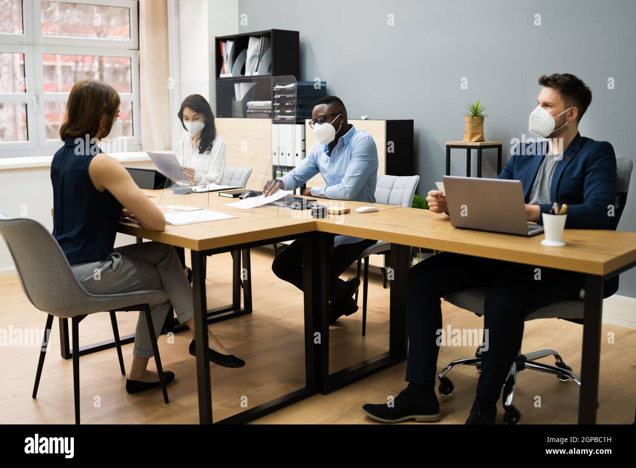 Business Manager Job Interview Talking In Face Mask Stock Photo - Alamy