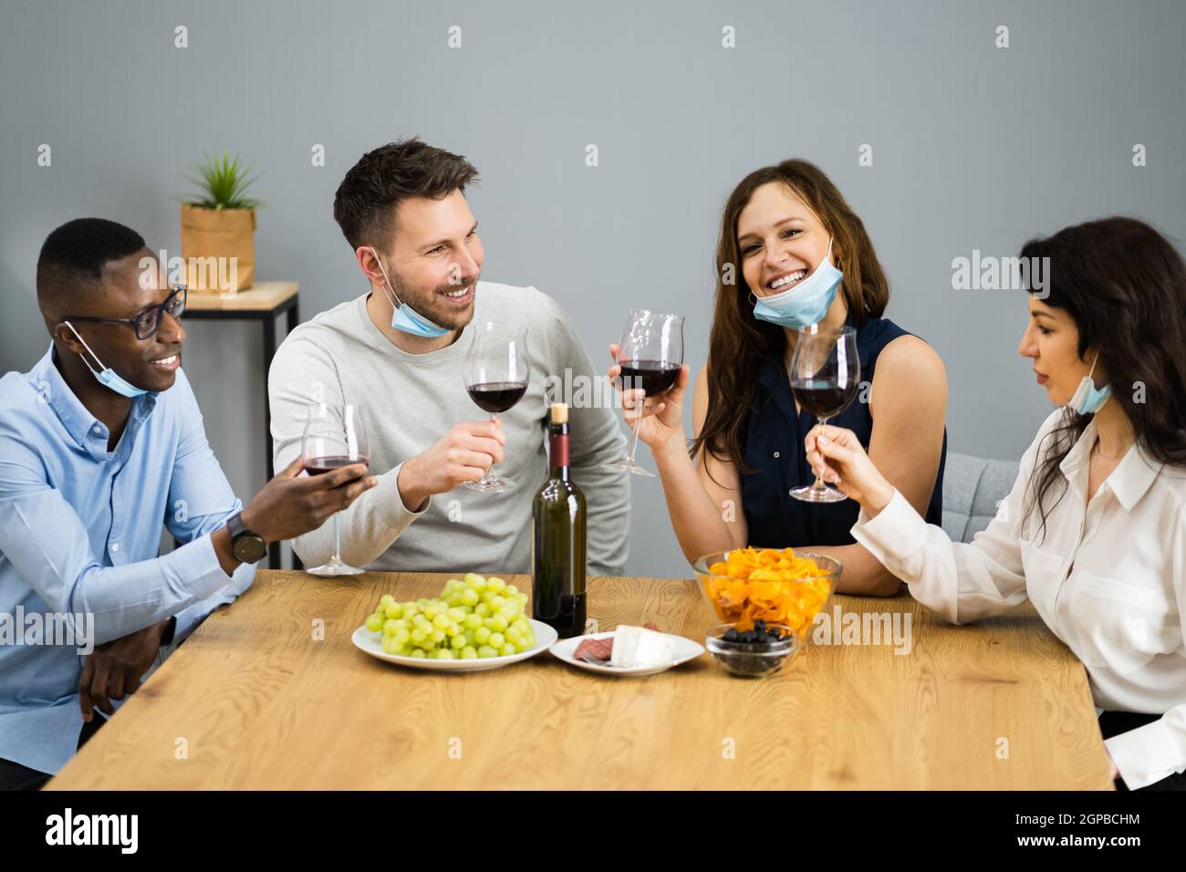 Fun People Food Party. Friends Having Dinner Stock Photo - Alamy