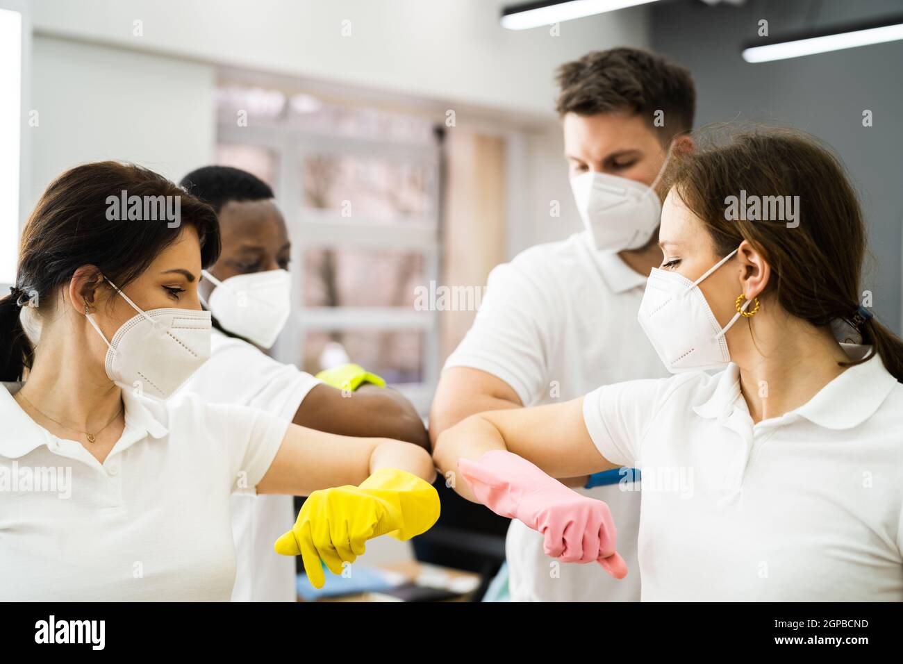 Cleaning Team Staff In Uniform And Face Mask Stock Photo - Alamy