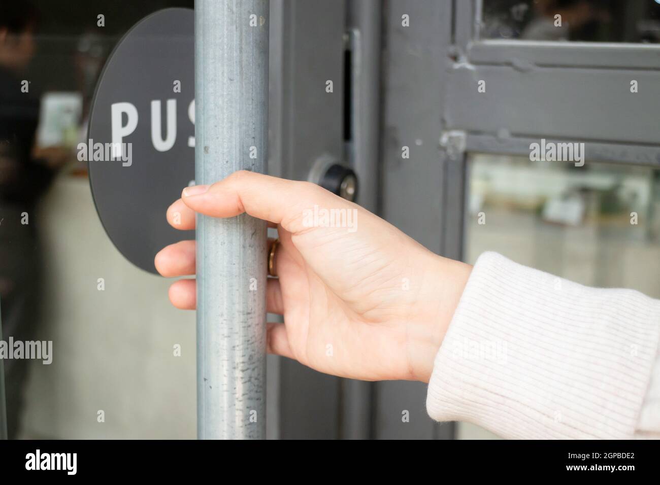 Hand on handle door for open to entering restaurant, stock photo Stock ...