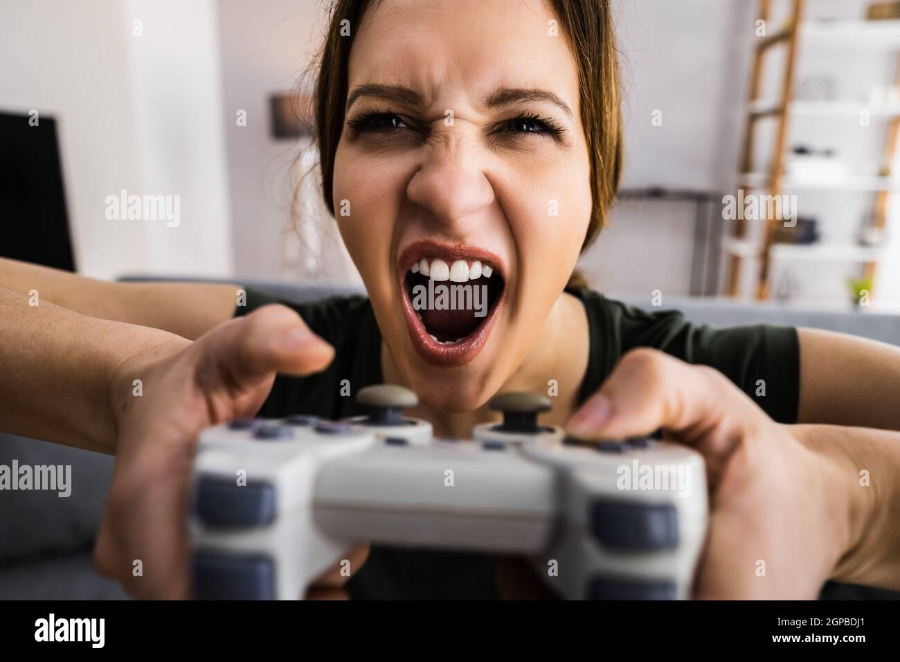 Female Gaming Addiction. Player With Console Controller Stock Photo - Alamy