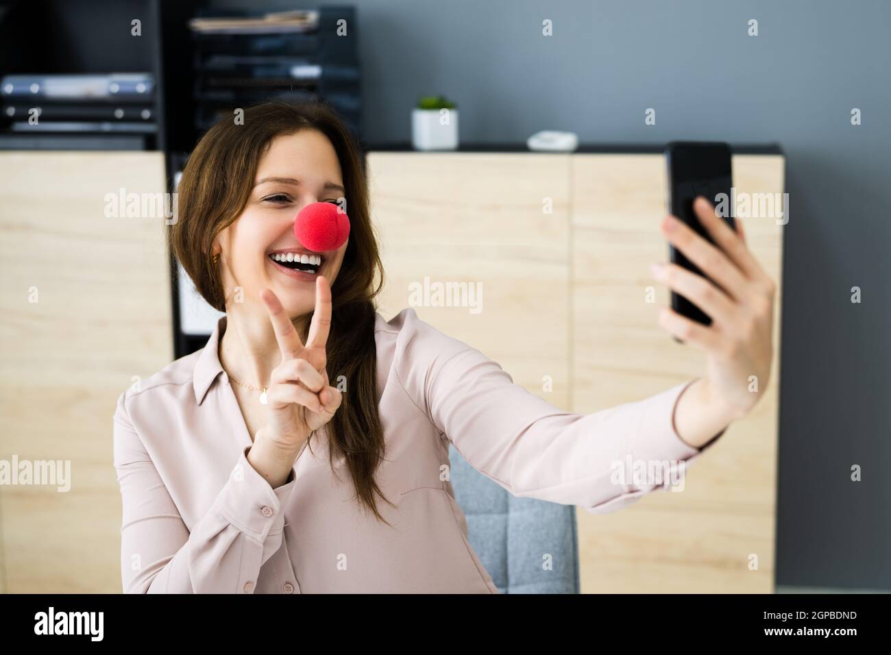 Happy Working People Using Mobile Phone In Office Stock Photo - Alamy