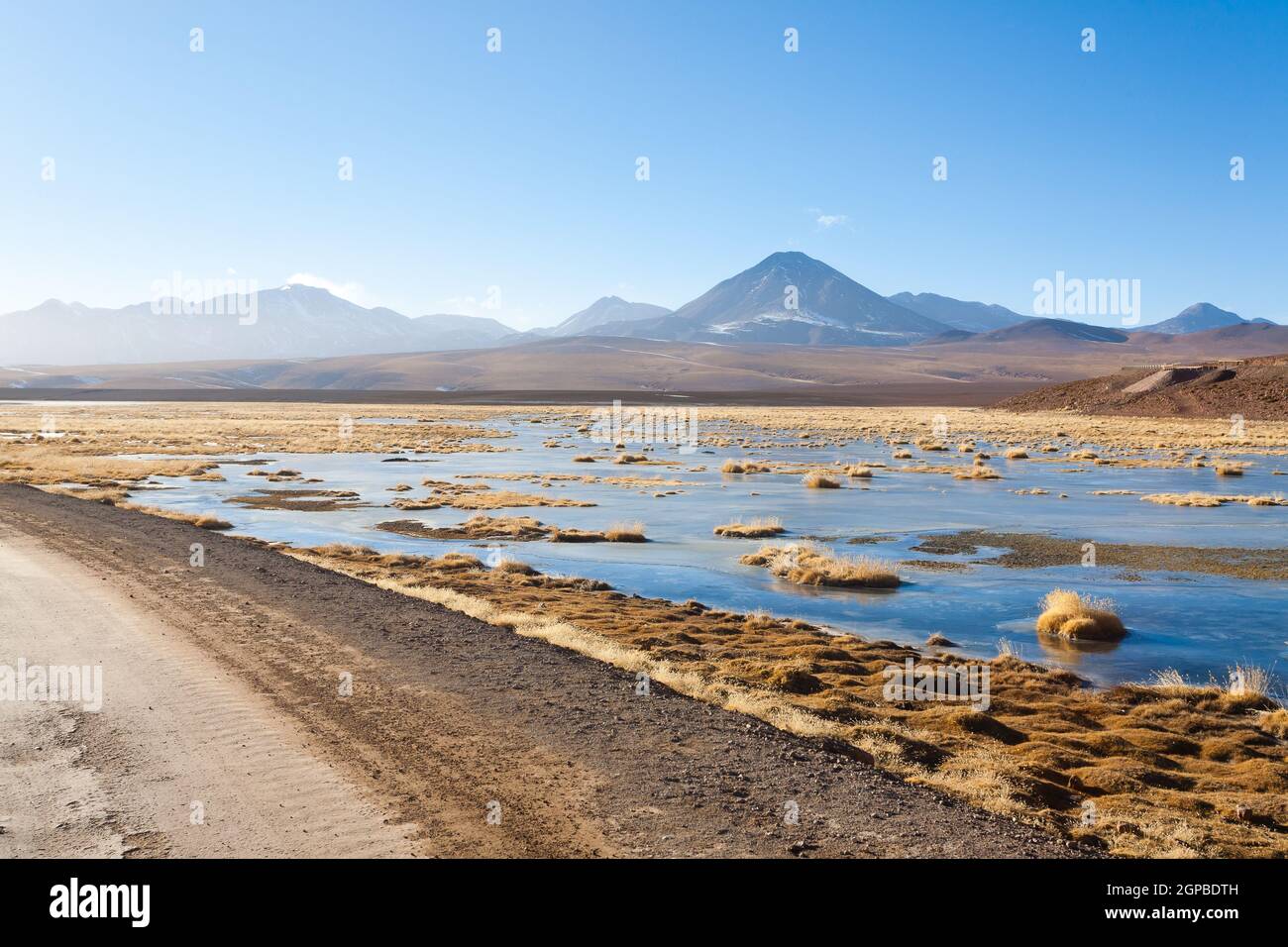 Chilean landscape, dirt road and Licancabur volcano. Chile panorama ...