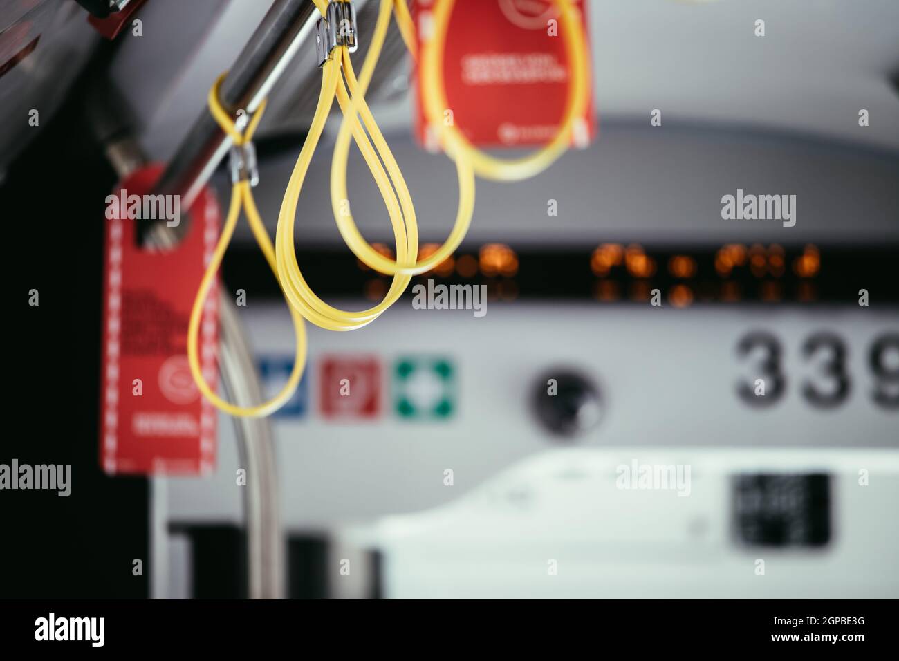 Hold on straps in a bus, commuting, public transport Stock Photo - Alamy