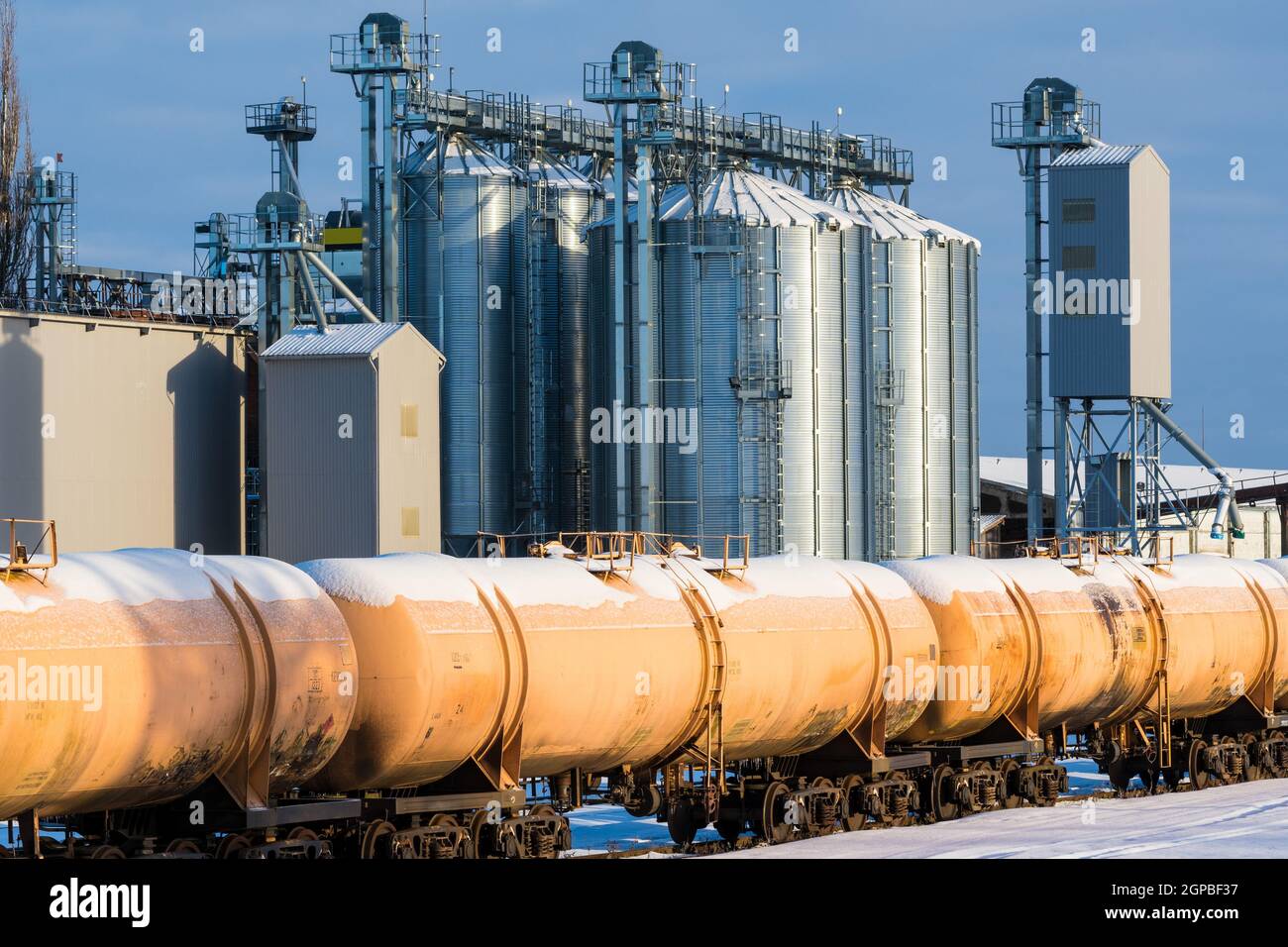 Train delivering oil in tanks in the industrial area Stock Photo - Alamy
