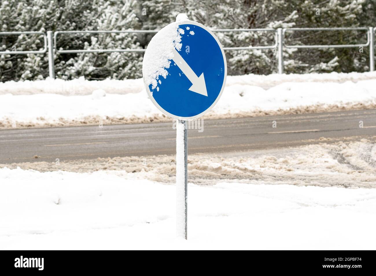 Warning traffic sign. Frozen Road ice-covered direction sign detour on ...