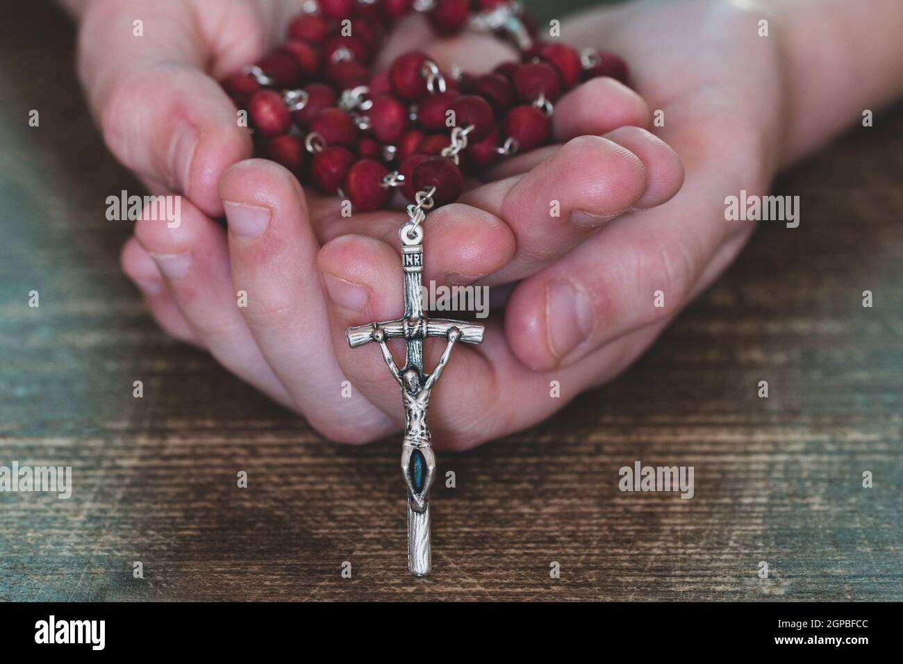 Close-up of little child hands holding rosary. Child praying Stock ...