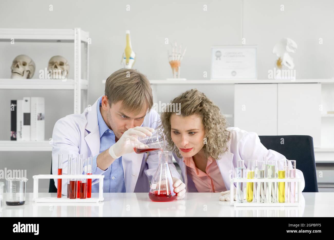 Brazilian scientists are carefully mixing toxic chemicals. A young ...