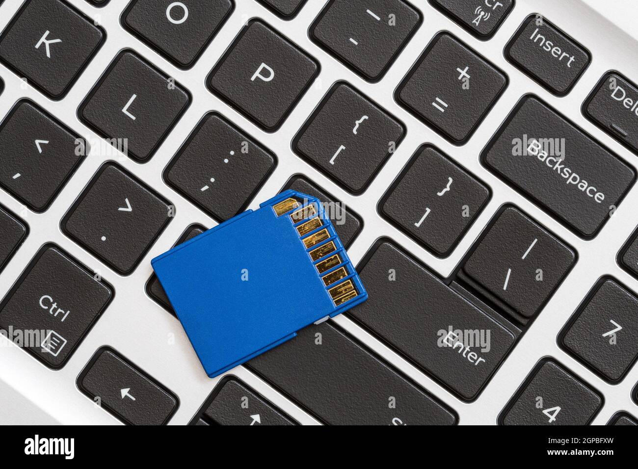 Blue SD memory card on the laptop keyboard Stock Photo - Alamy
