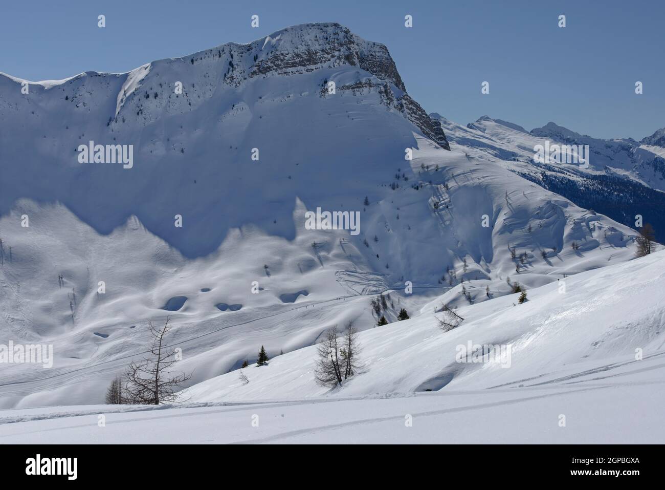 bright snowy valley and famous mountain in Dolomites, shot under deep ...