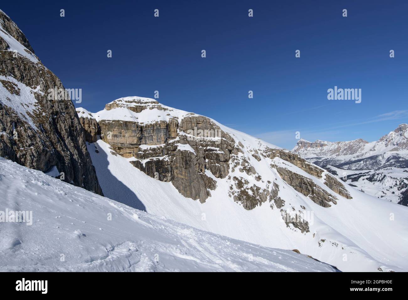 bright snow on slopes in Dolomites under famous mountain peaks, shot ...