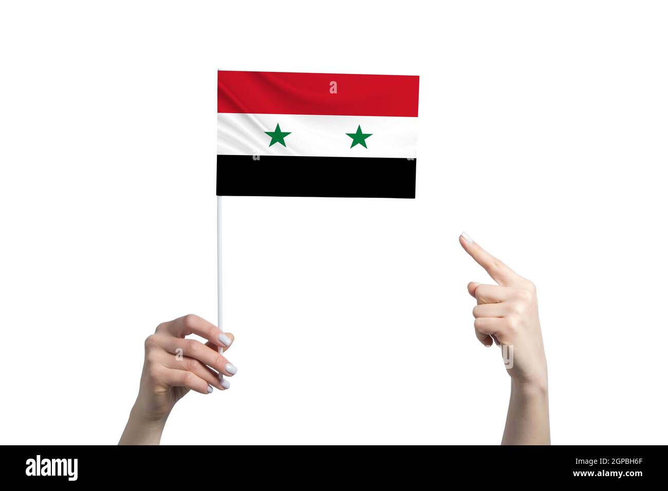 A beautiful female hand holds a Syria flag to which she shows the ...