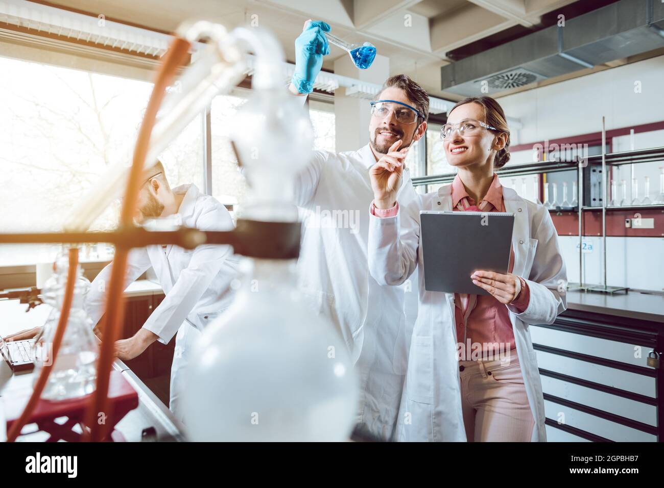 Two happy chemical scientists during breakthrough experiment Stock ...