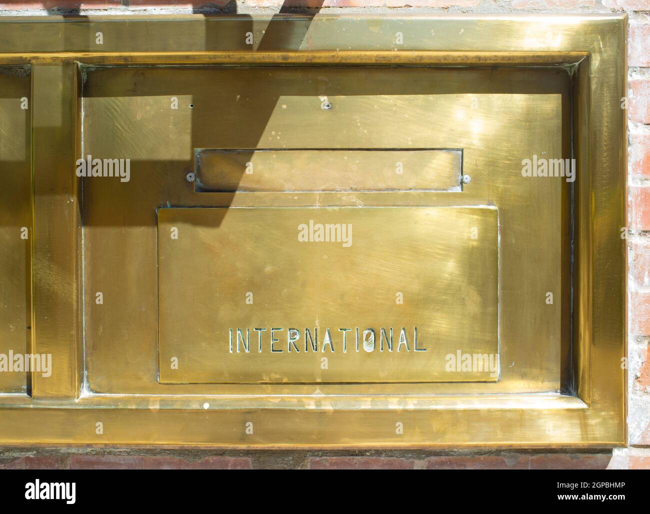 Post office golden brass mailbox. Engraved word International Stock ...