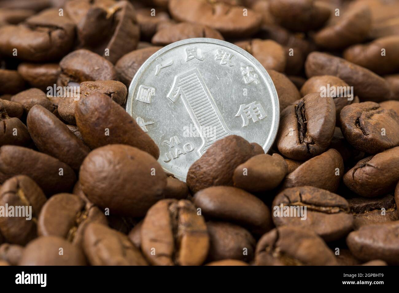 China coffee market. Roasted coffee beans and Chinese yuan Stock Photo ...