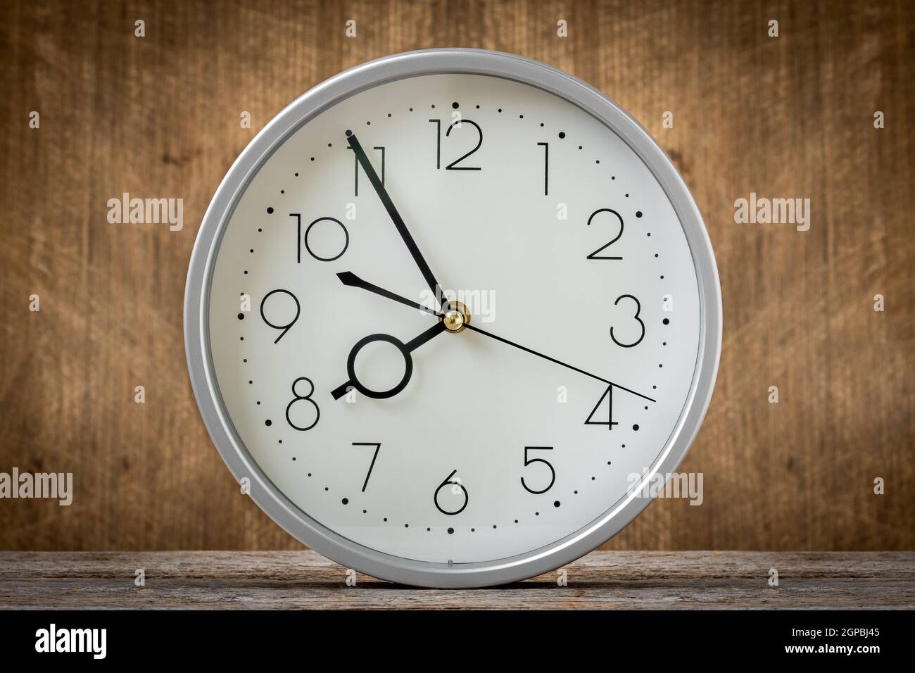 Clock showing 7:55 o'clock in a morning Stock Photo - Alamy