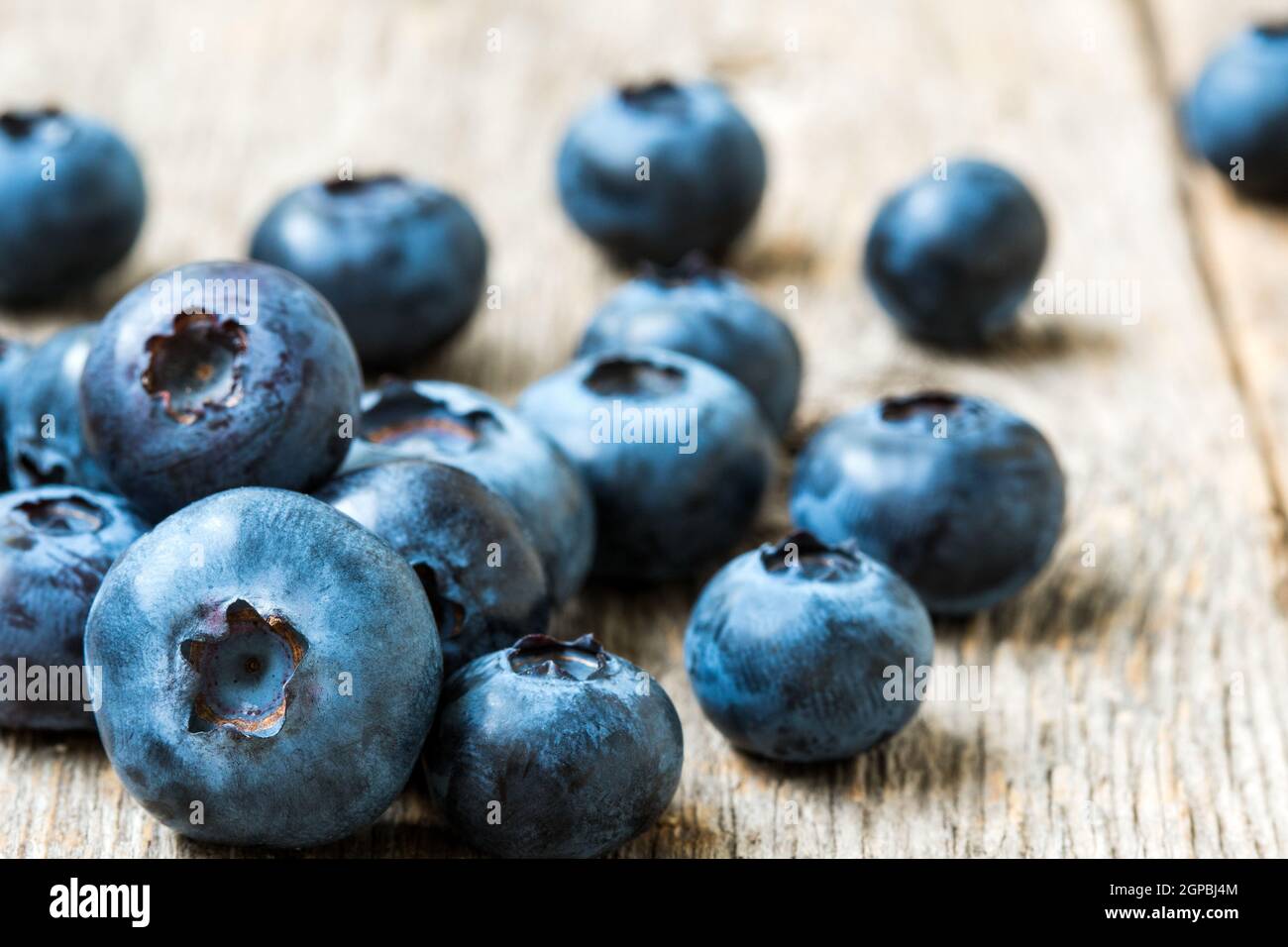 High huckleberry on rustic wood table background, close-up view Stock ...