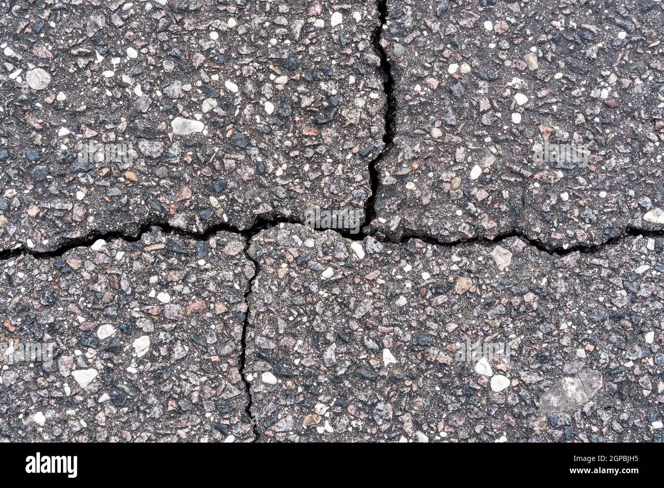 Crack in the pavement, the destruction of the road Stock Photo - Alamy