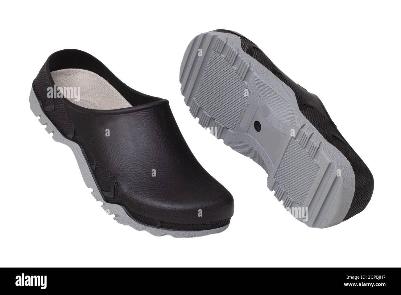 Closeup of a comfortable pair of black garden or work clogs isolated on ...