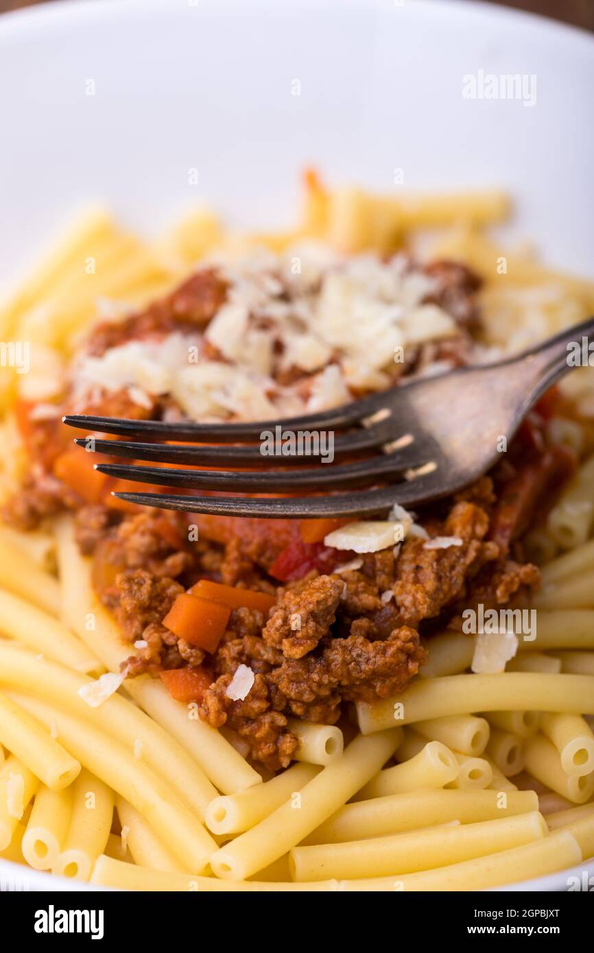 maccheroni pasta with sauce bolognaise on wood Stock Photo - Alamy