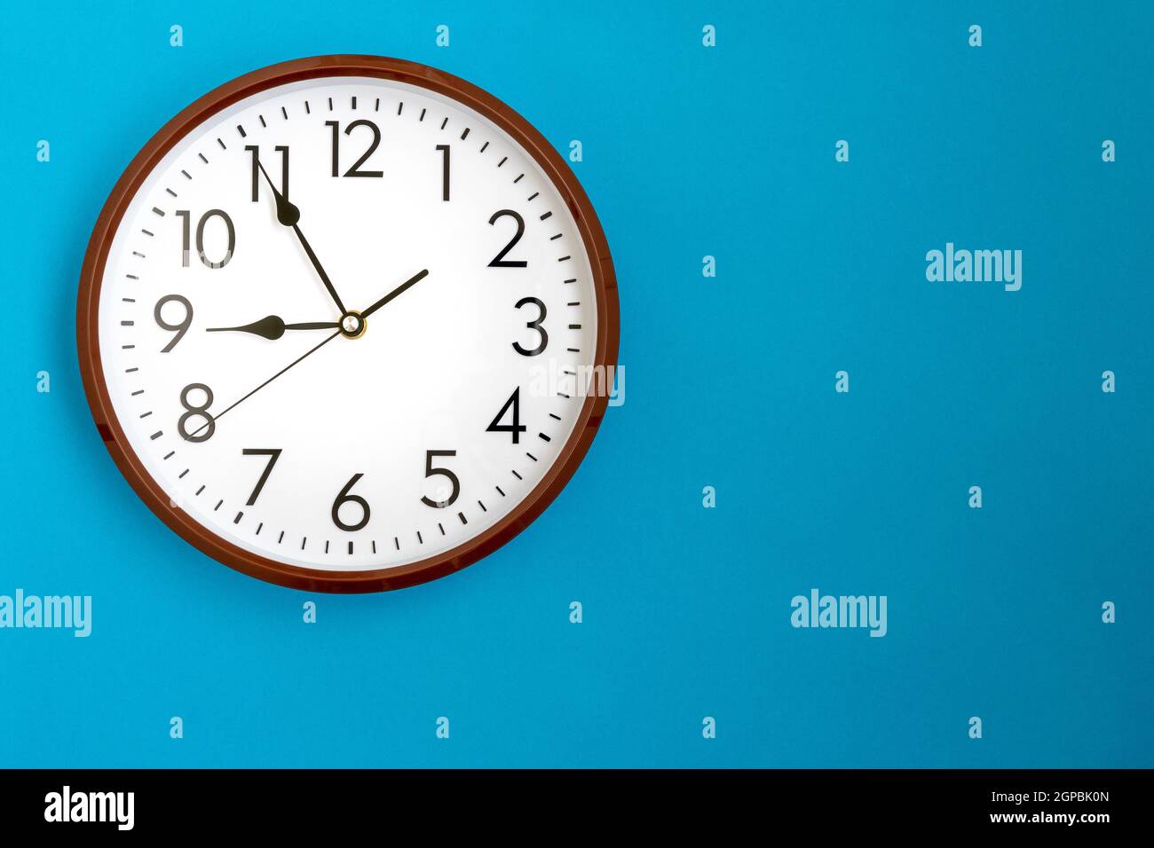 Classic wall clock showing 8:55 o'clock Stock Photo - Alamy