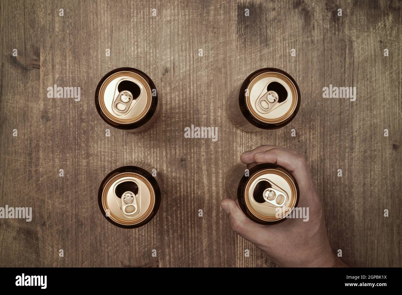 Top view of hand with four opened beer cans Stock Photo - Alamy