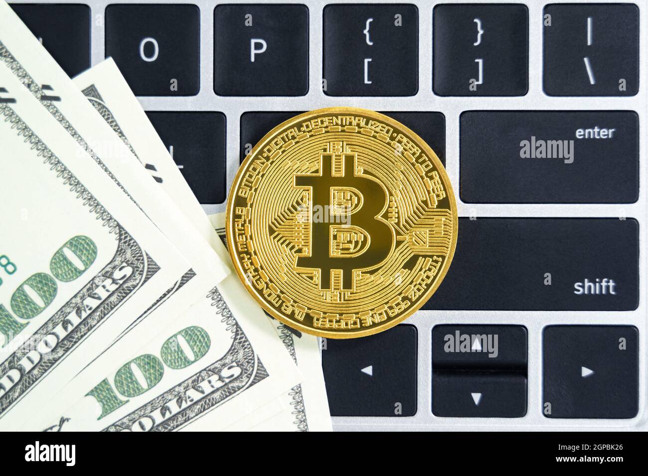 Golden Bitcoins coin and US banknotes keyboard computer. Close up of ...