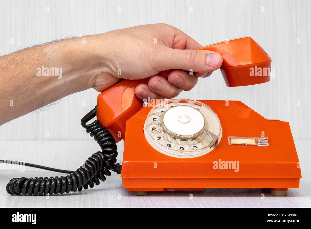 Human hand picking up the phone. Customer service or communication ...