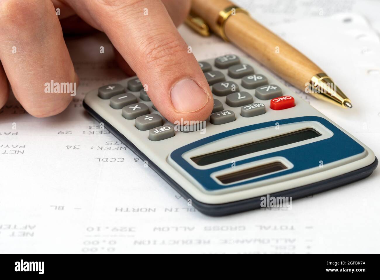 Close up on accountant hand pressing on calculator for calculate ...