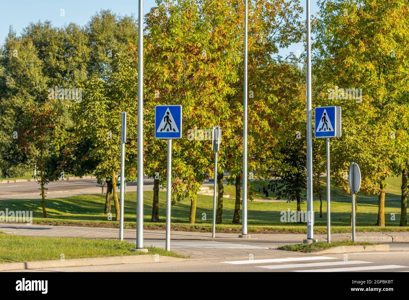 Blue square pedestrians traffic signs on the crosswalk Stock Photo - Alamy