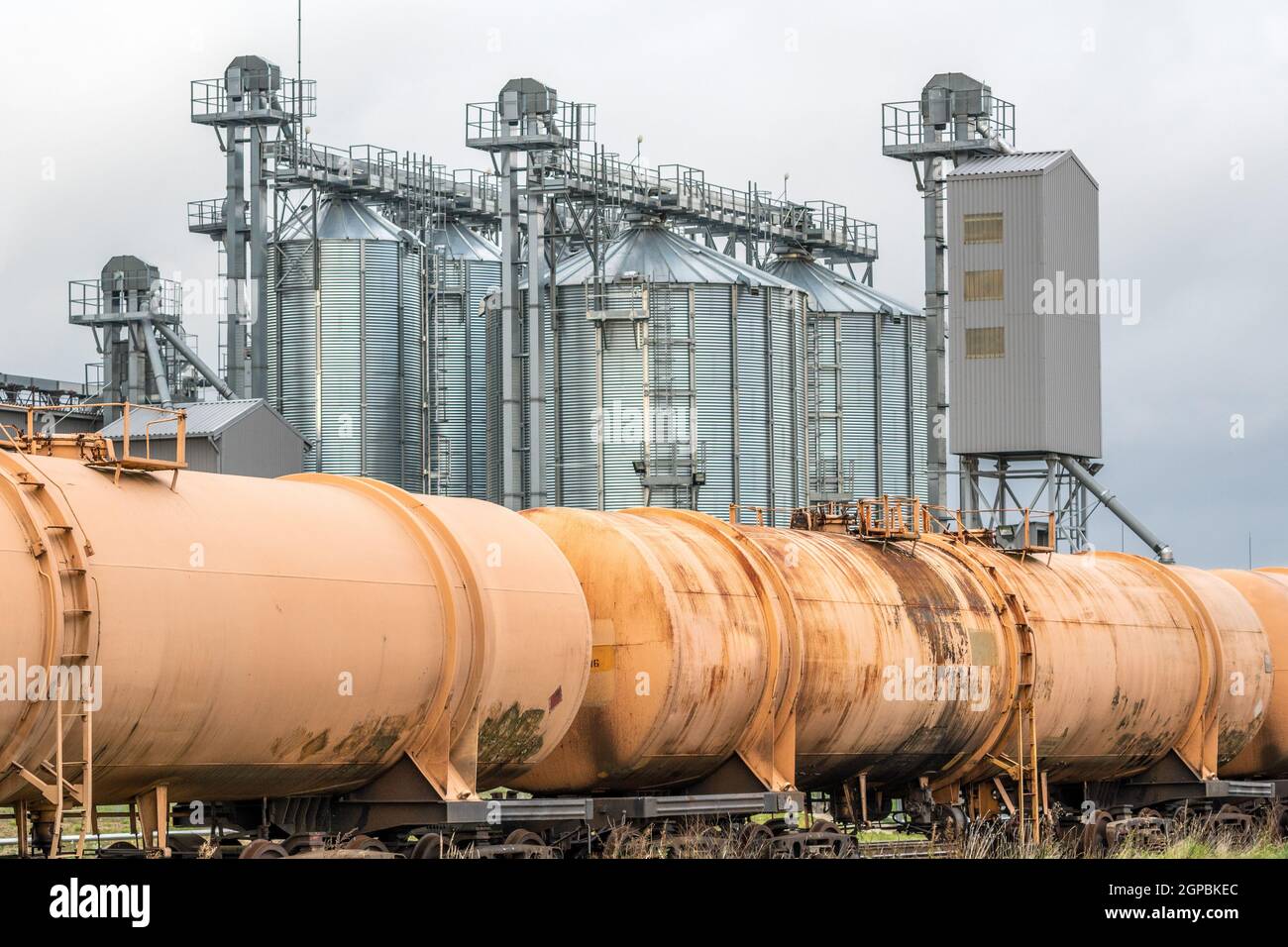 Train delivering oil or gas in tanks in the industrial area Stock Photo ...